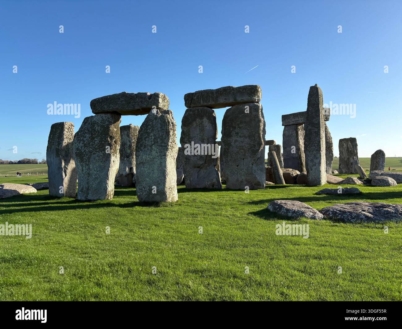 Stonehenge prehistoric stone circle standing on green grass under a ...
