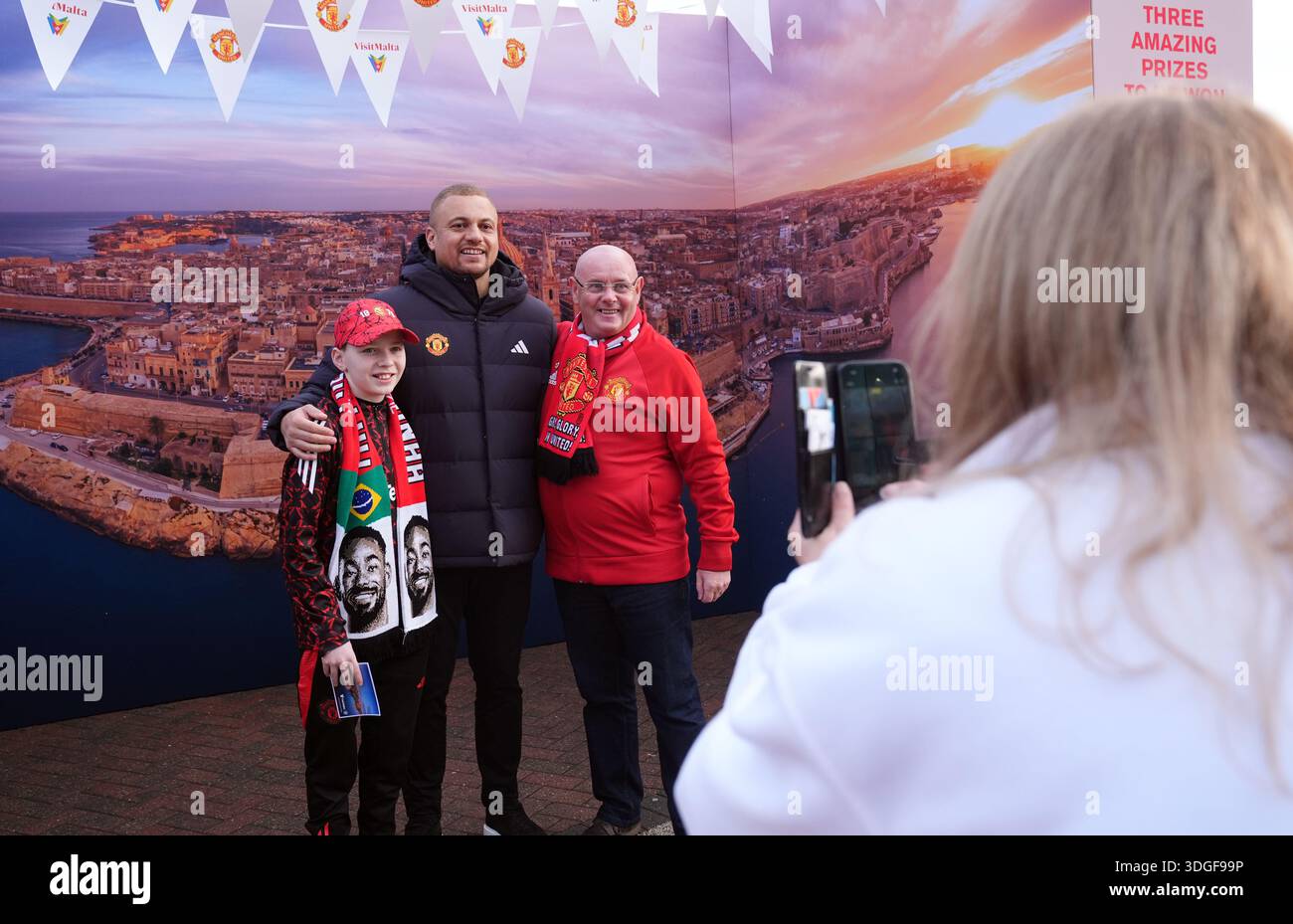 Manchester United fans pose for a picture with former player Wes Brown ...