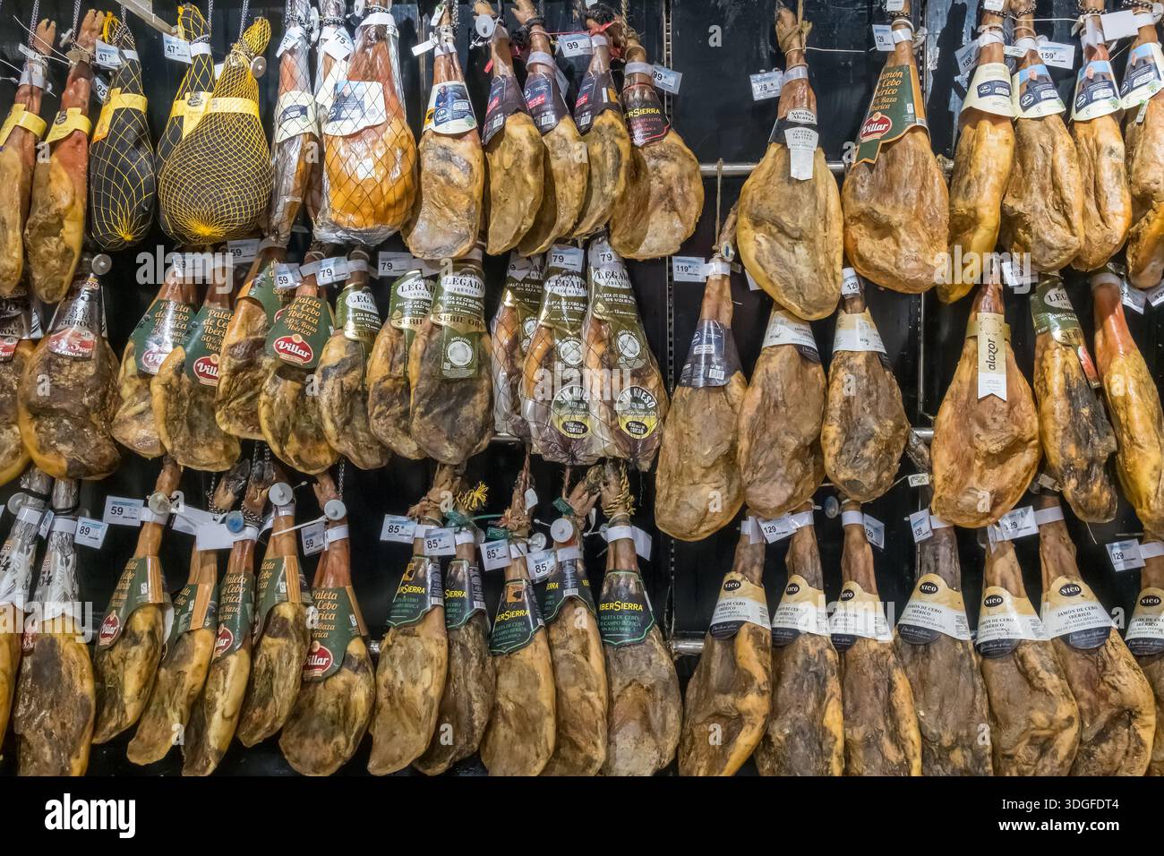 Spanish Serrano and Iberico hams in a supermarket Stock Photo - Alamy