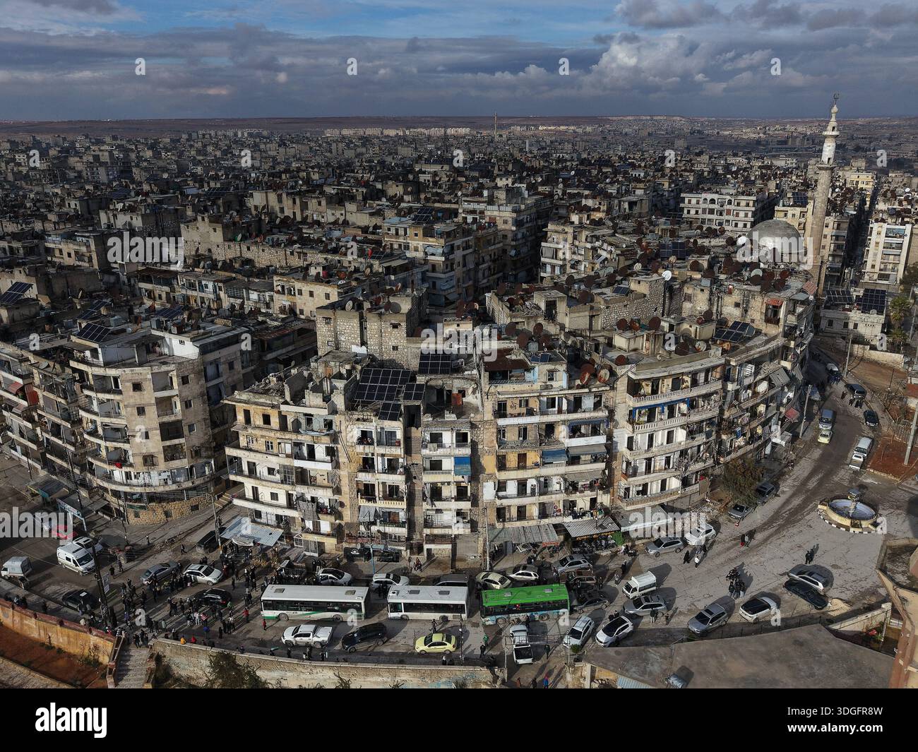 FILE - An aerial view shows buses carrying displaced residents as they ...