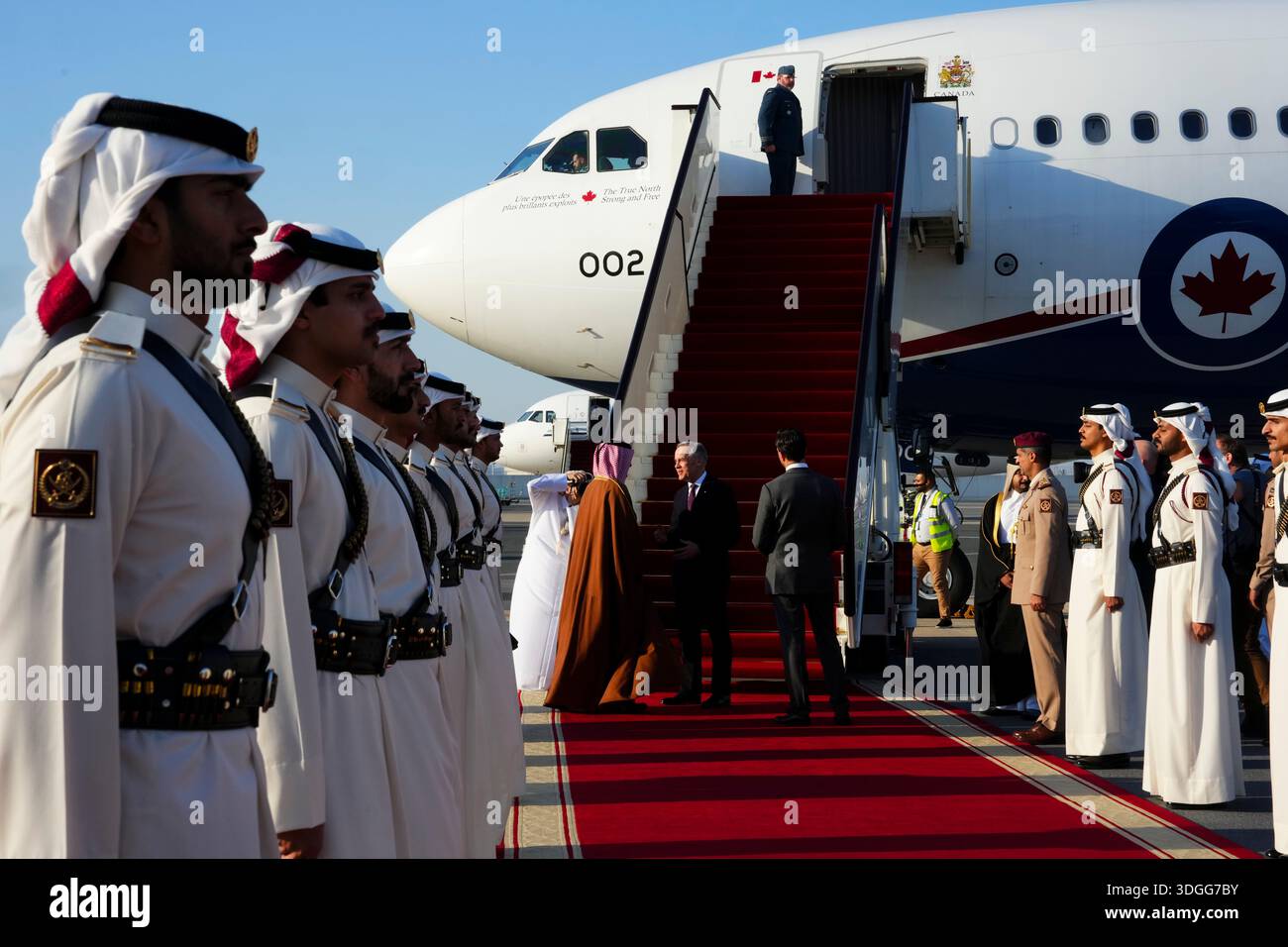 Doha, Qatar. 17th Jan, 2026. Prime Minister Mark Carney, middle, is ...