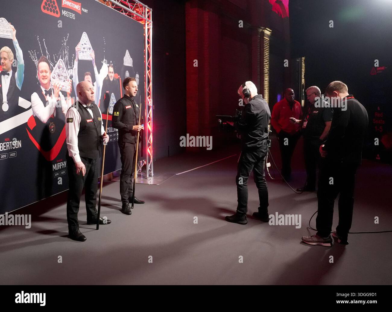 John Higgins (left) and Judd Trump wait to walk out for the start of ...