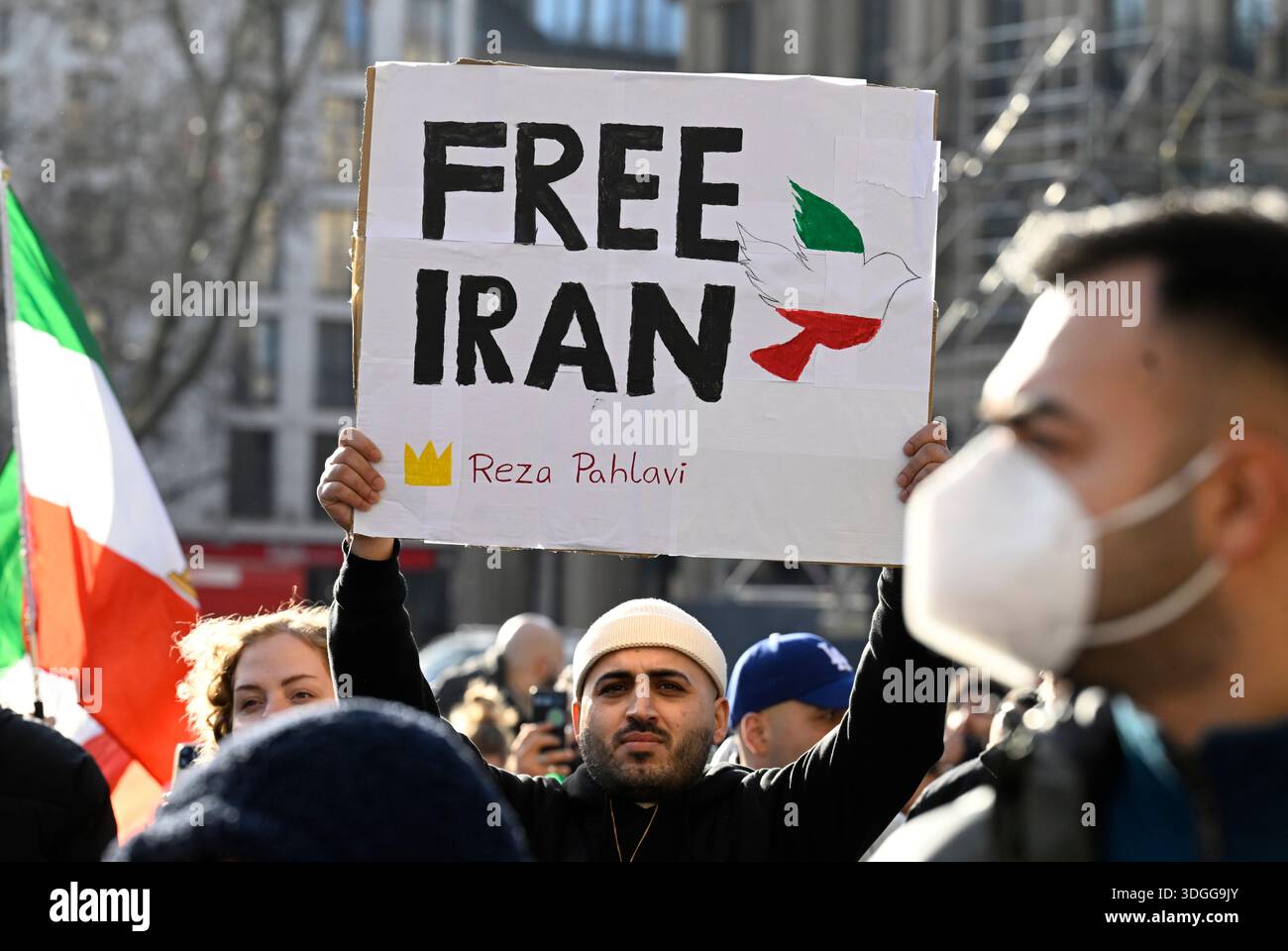 Cologne, Germany. 17th Jan, 2026. Participants hold signs and flags ...