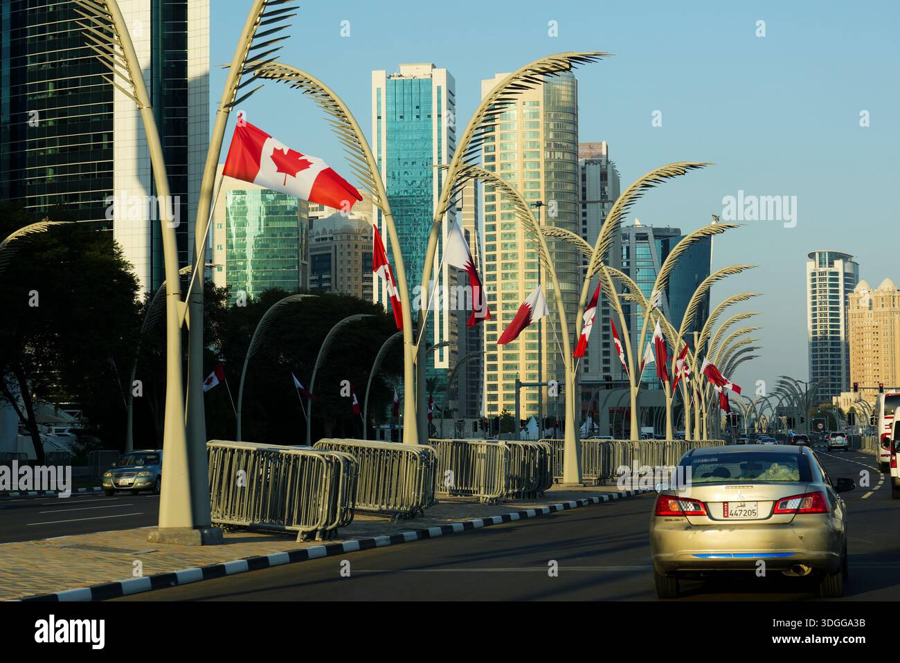 Doha, Qatar. 17th Jan, 2026. Canada flags line a main boulevard as ...