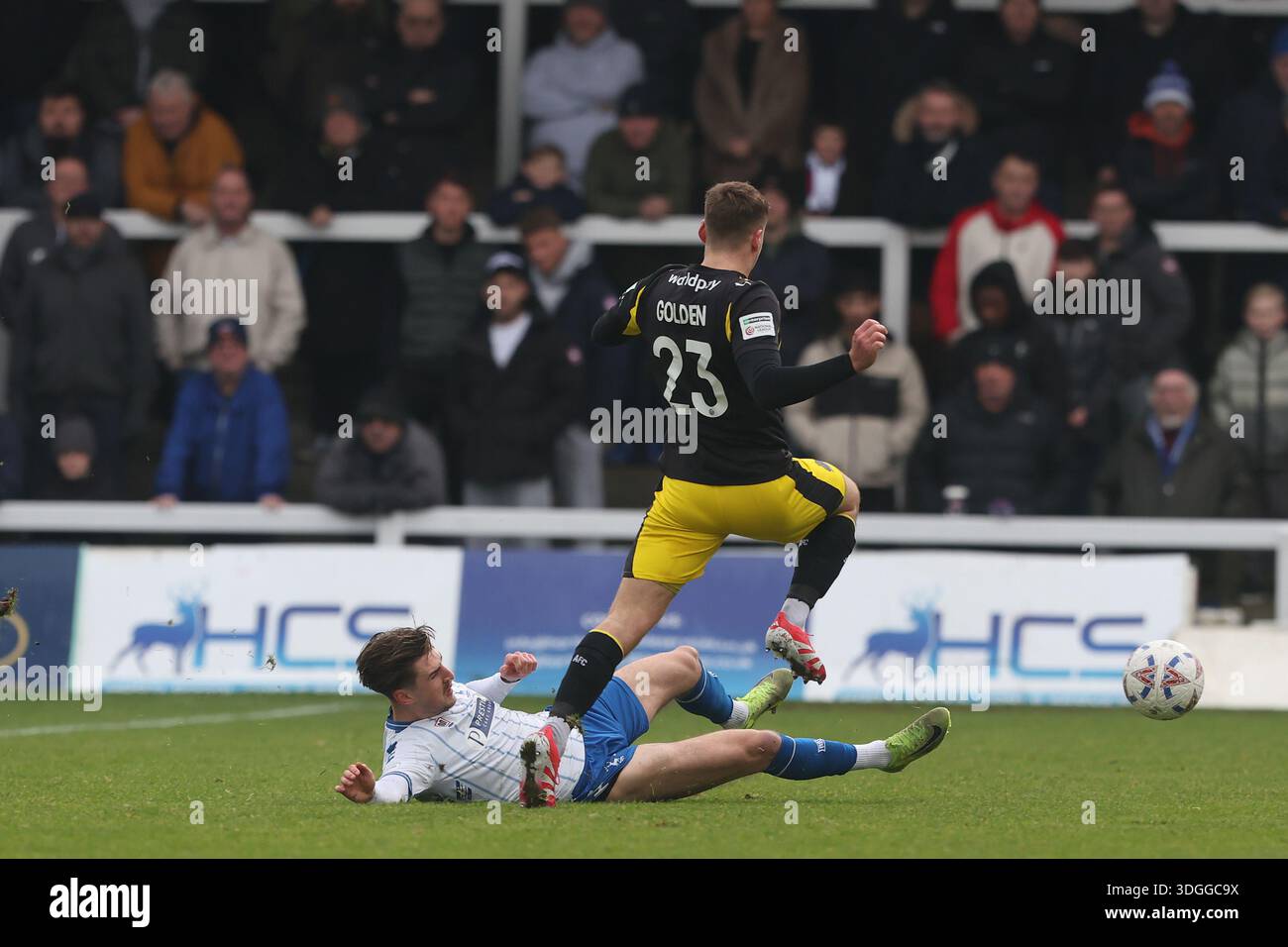 Hartlepool United's Jay Benn tackles Altrincham's Tylor Golden during ...