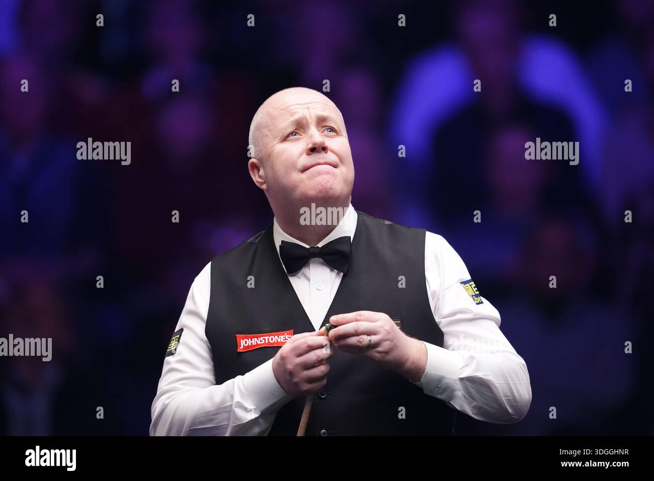 John Higgins in action against Judd Trump (not pictured) on day seven ...