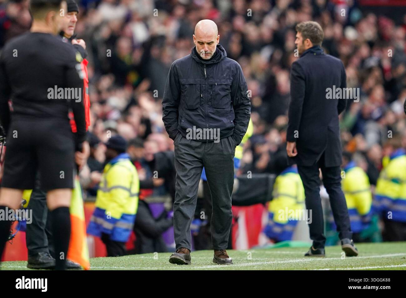 Manchester City's head coach Pep Guardiola walks during the English ...