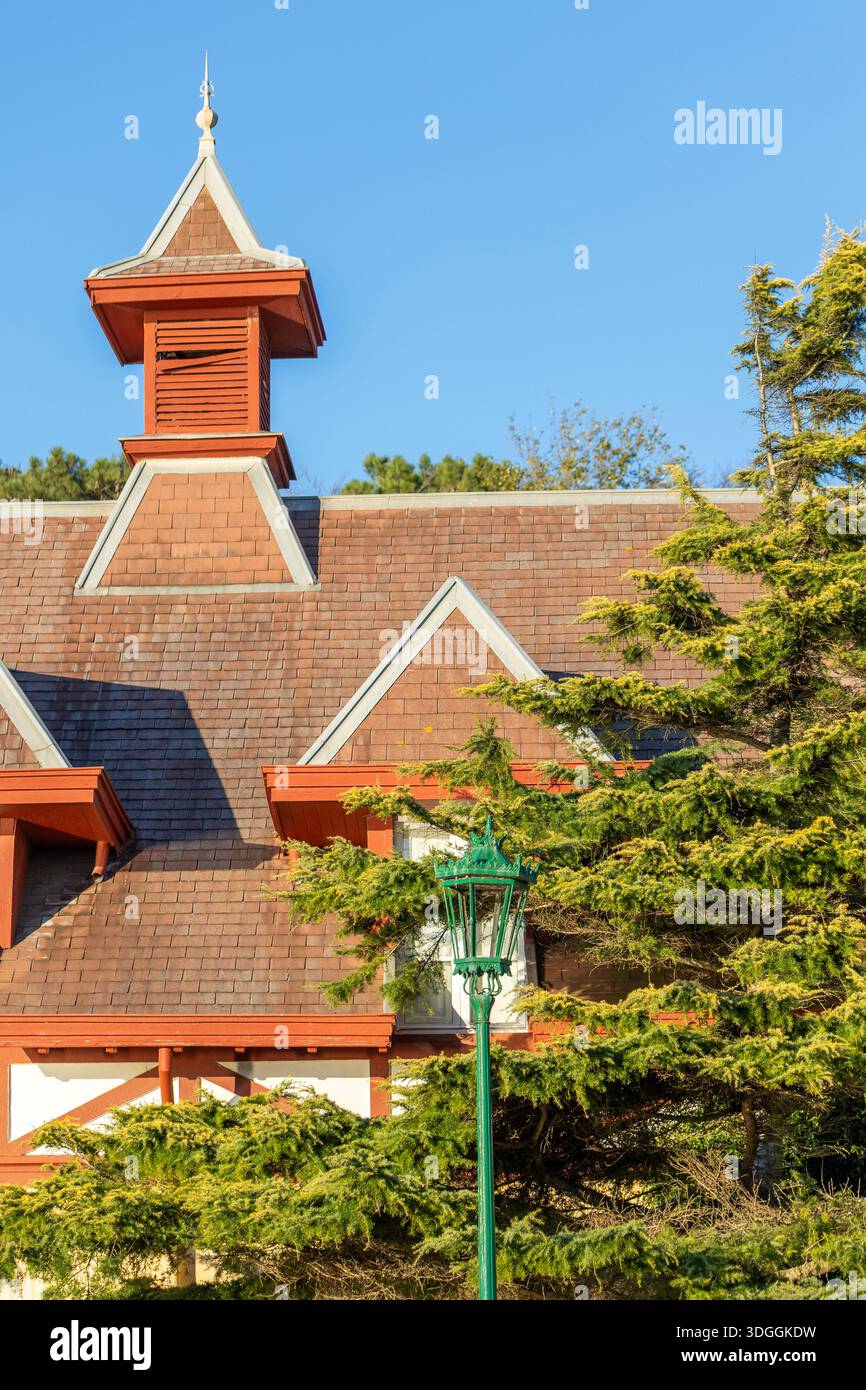 Architectural details of a historic building with a tiled roof, dormer ...