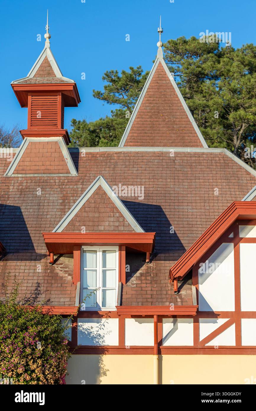 Architectural details of a historic building with a tiled roof, dormer ...