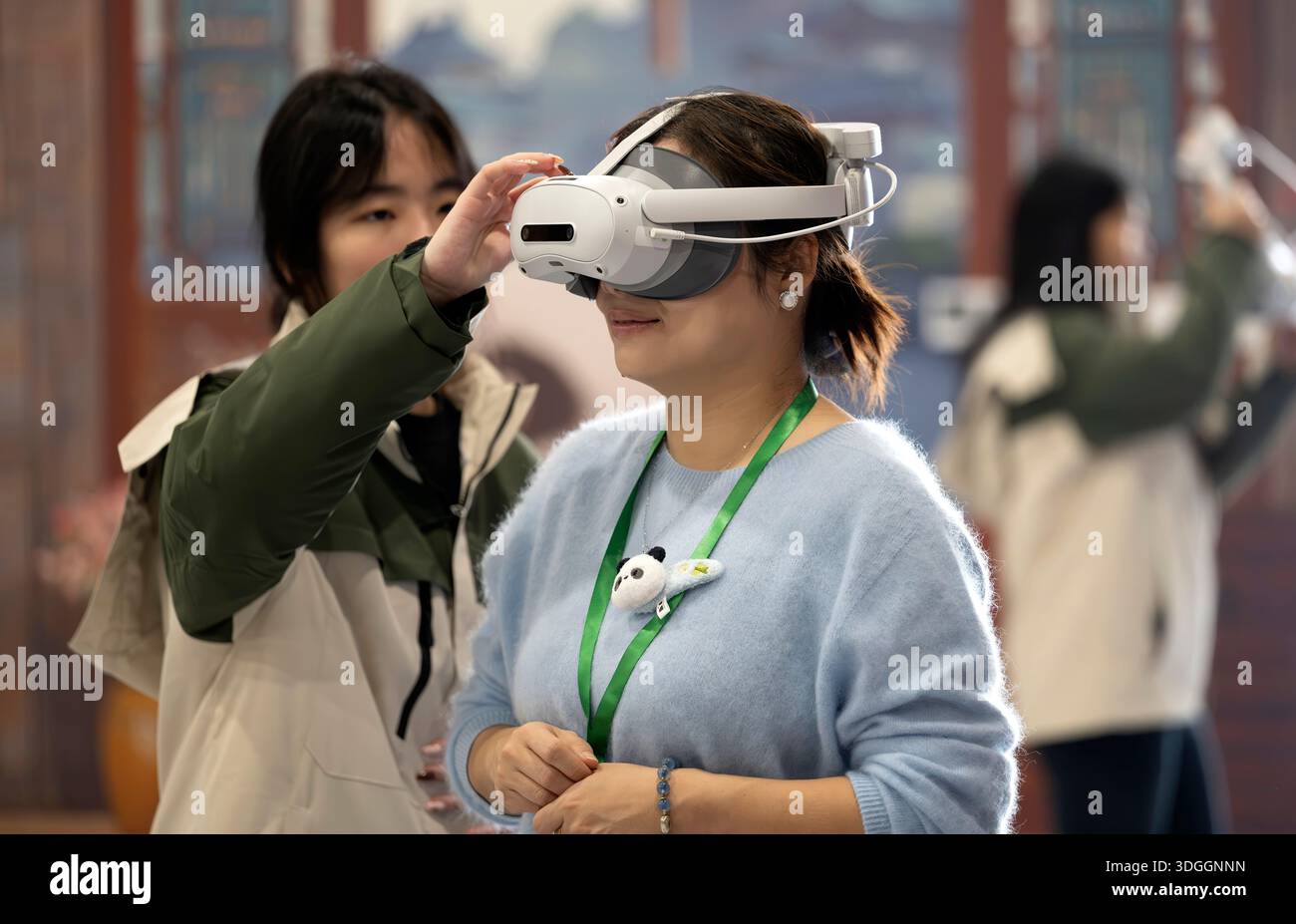 Fuzhou. 17th Jan, 2026. A visitor tries out a virtual reality headset ...
