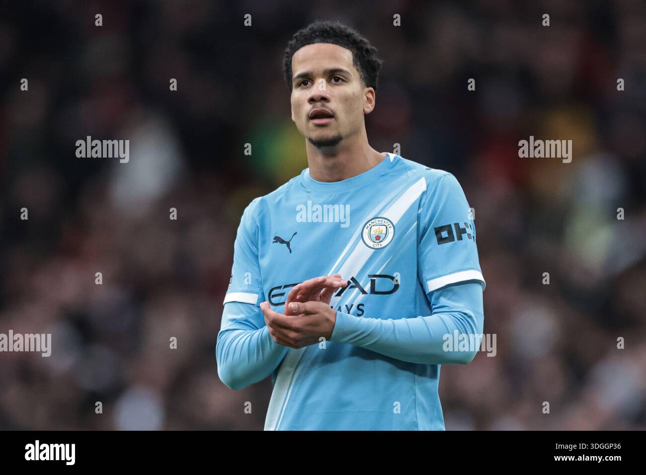 Divine Mukasa of Manchester City applauds the fans after the final ...