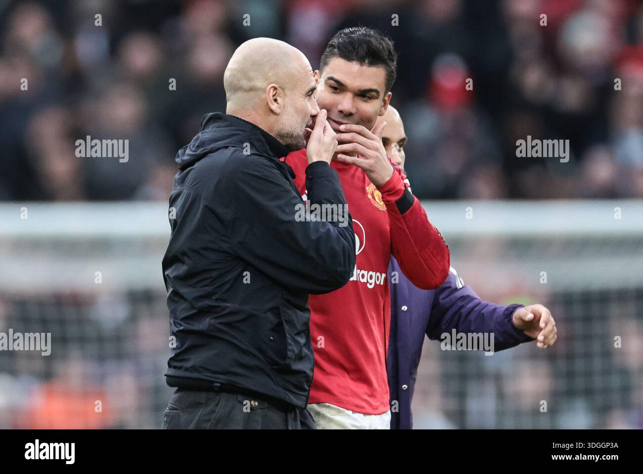 Pep Guardiola manager of Manchester City speaks with Casemiro of ...