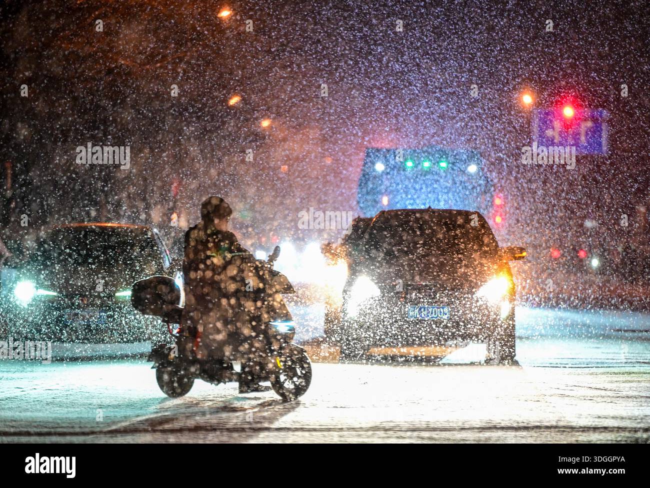 Beijing, China. 17th Jan, 2026. People wait at a red light amidst ...
