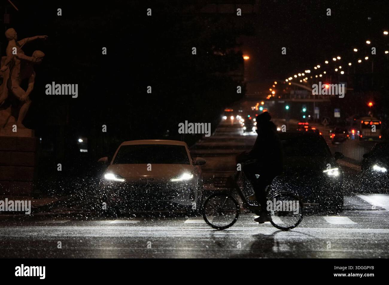 Beijing, China. 17th Jan, 2026. A cyclist rides amidst snowfall in ...