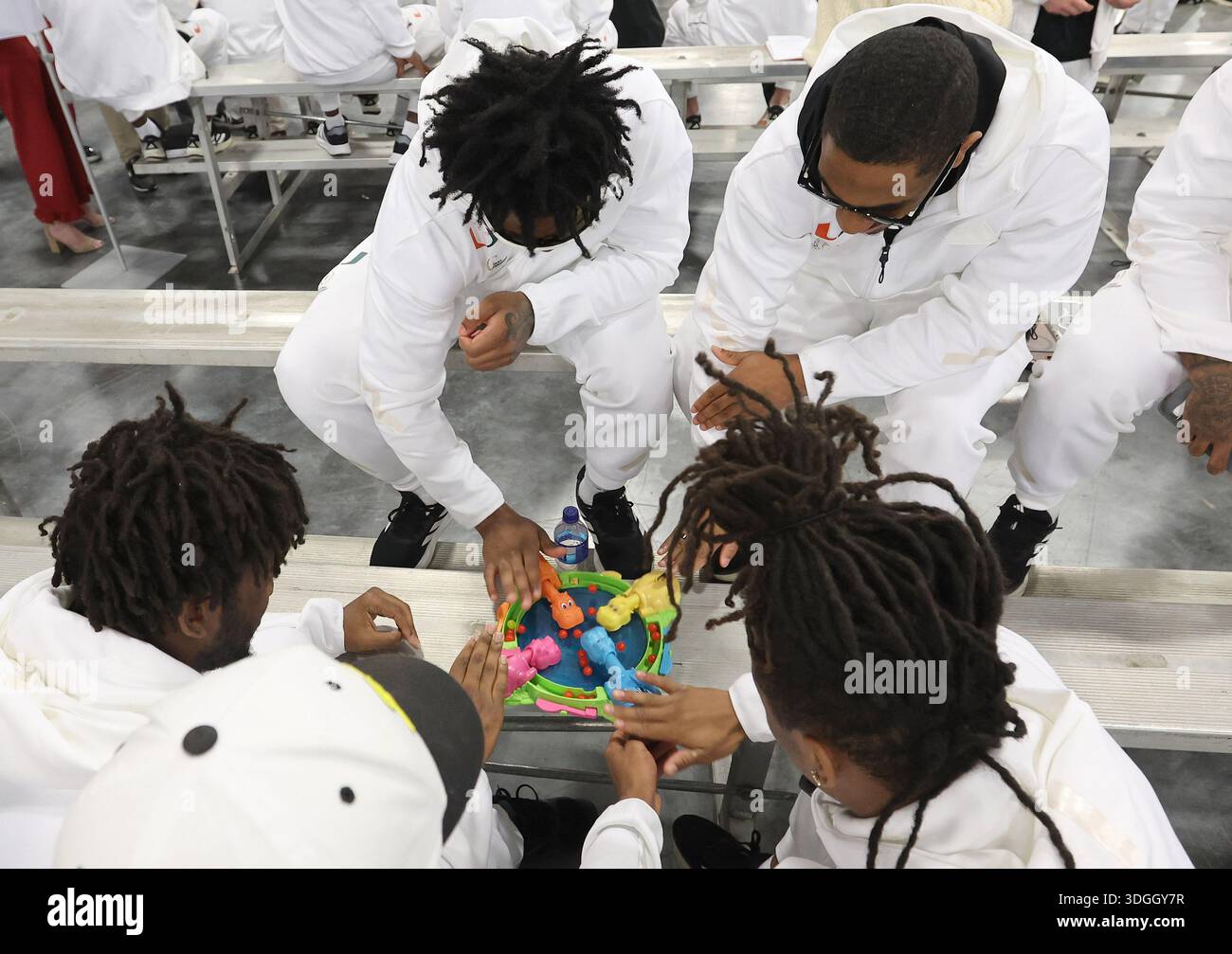 Miami, United States. 17th Jan, 2026. Miami Hurricanes players play a ...