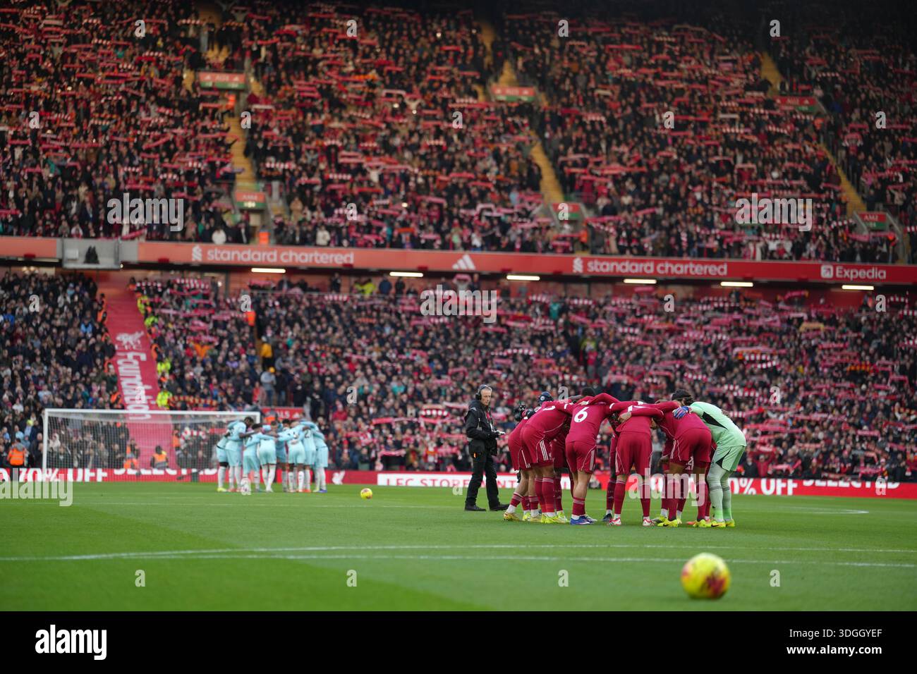 Liverpool players, right, huddle prior to the English Premier League ...