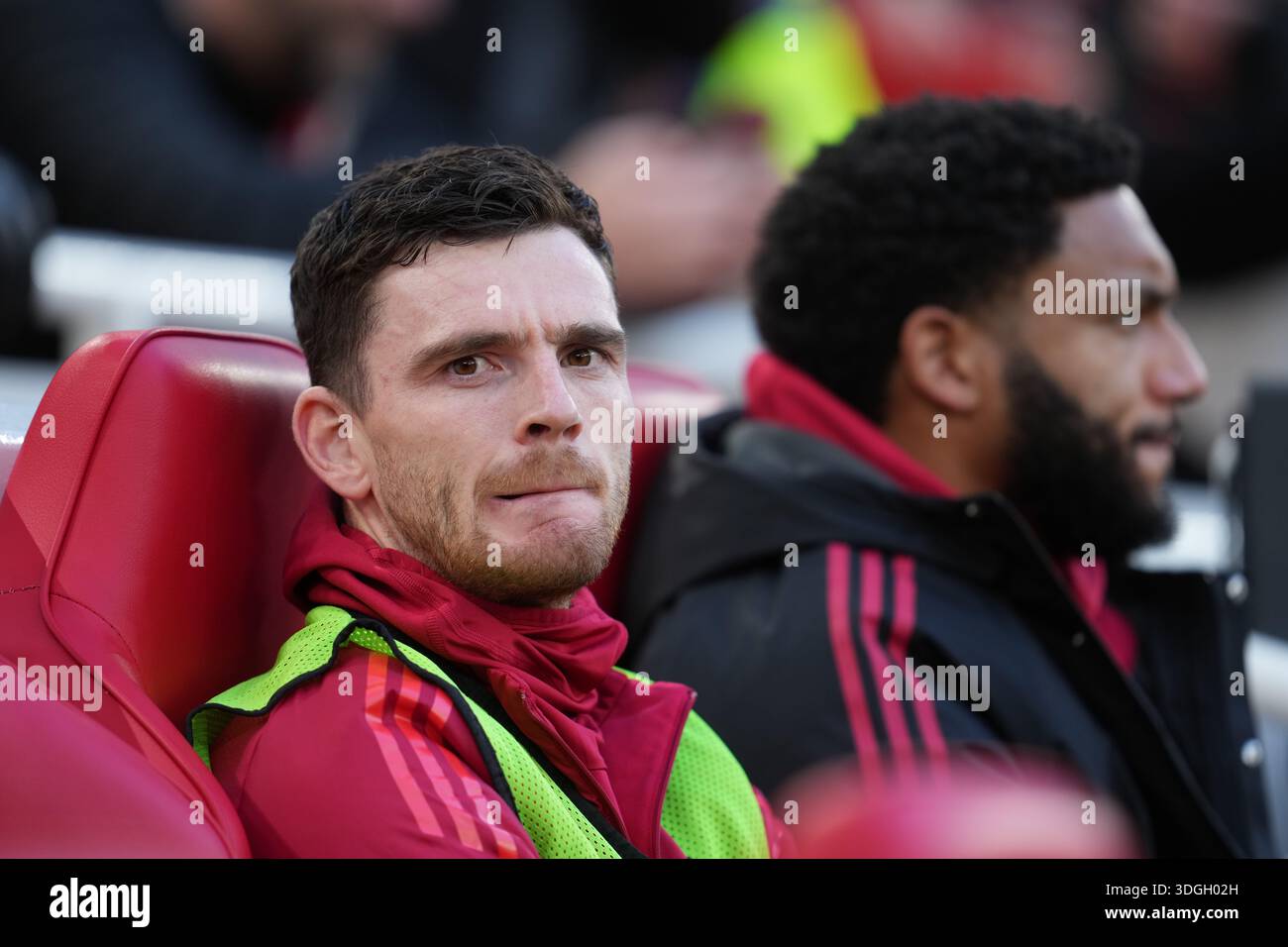 Liverpool's Andrew Robertson sits on the bench prior to the English ...