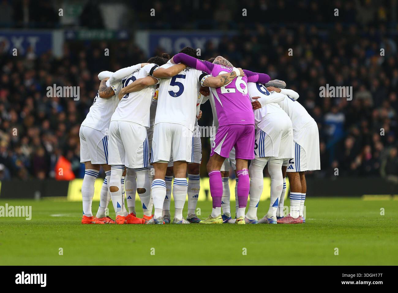 The Leeds United players huddle during the Premier League match between ...