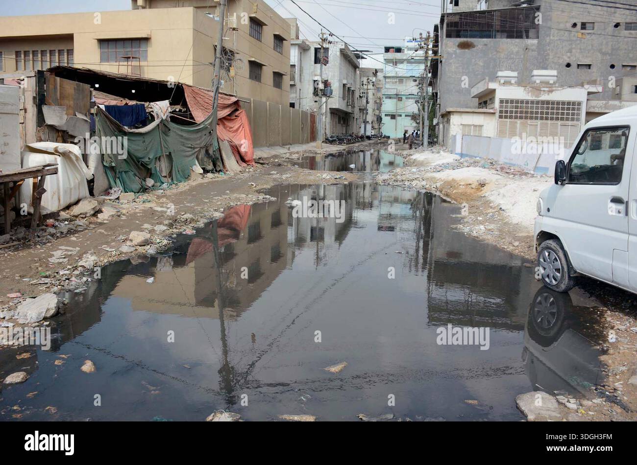 Hectic street full of garbage and sewerage water, causing unhygienic ...
