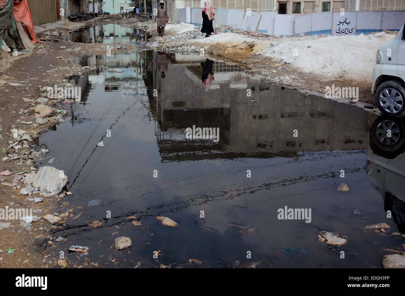 Hectic street full of garbage and sewerage water, causing unhygienic ...