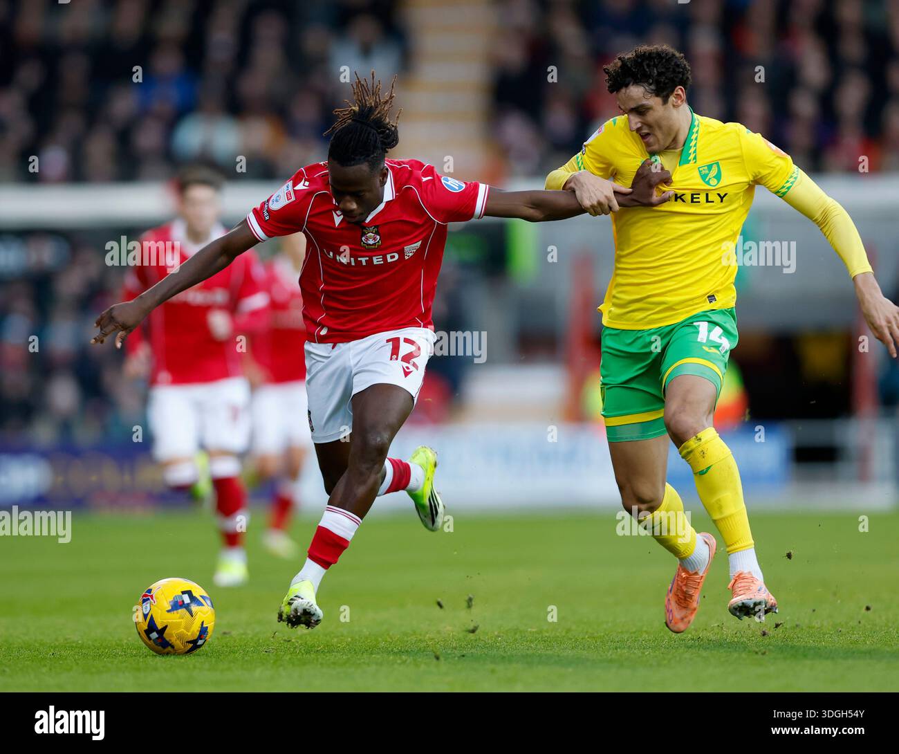 Wrexham's Issa Kabore Norwich City's Ben Chrisene battle for the ball ...