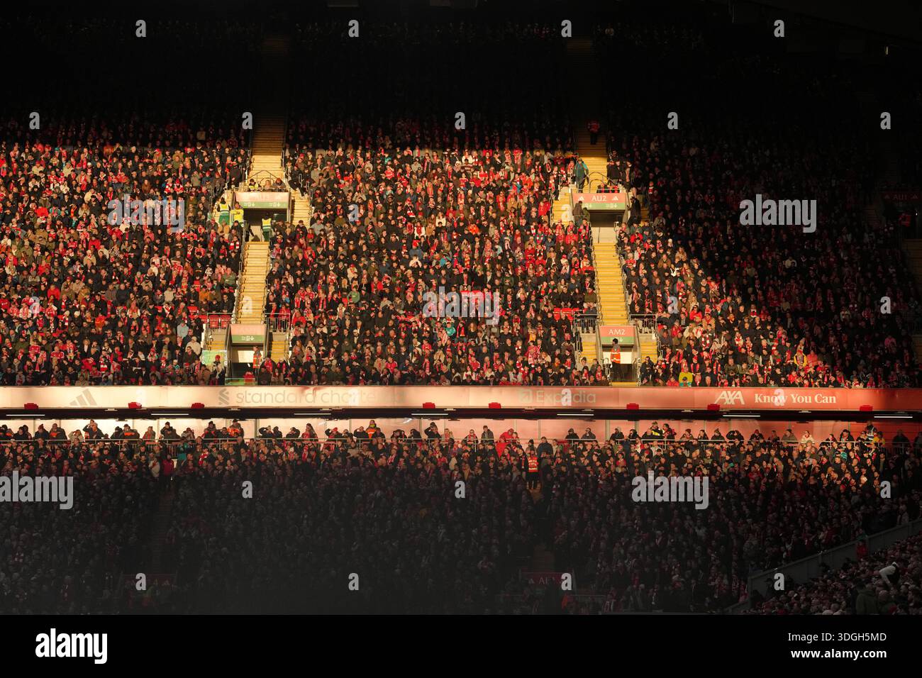 Fans watch the English Premier League soccer match between Liverpool ...