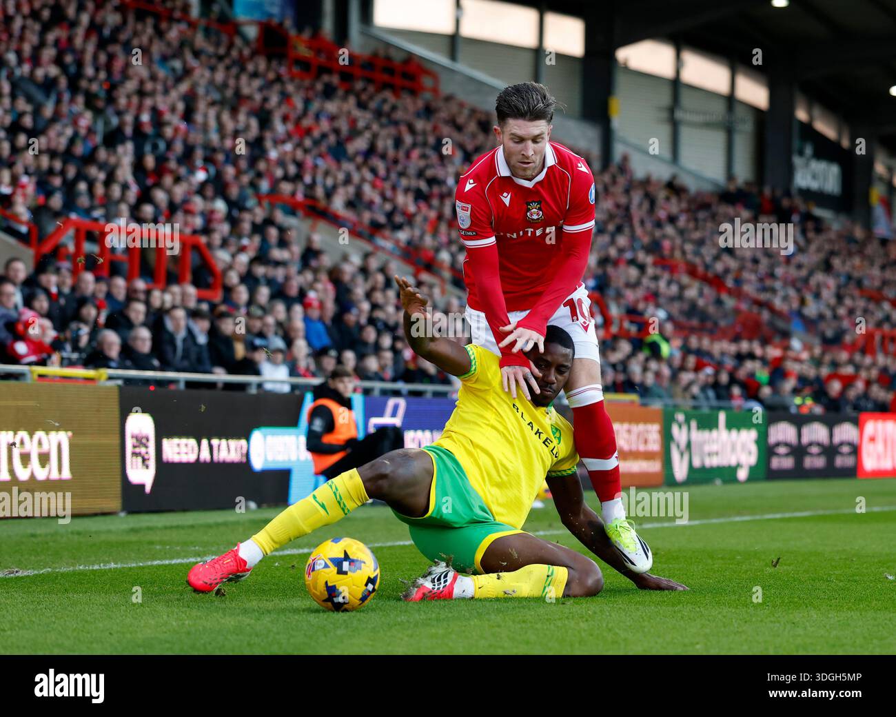 Wrexham's Josh Windass and Norwich City's Jose Cordoba battle for the ...