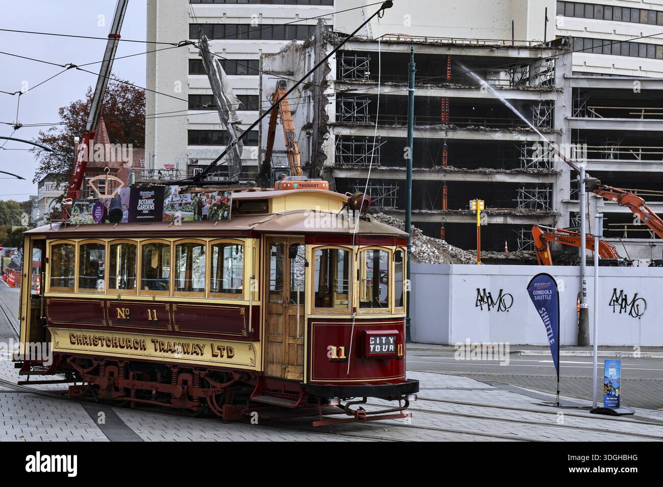 Historic tram in front of damaged buildings in Christchurch ...
