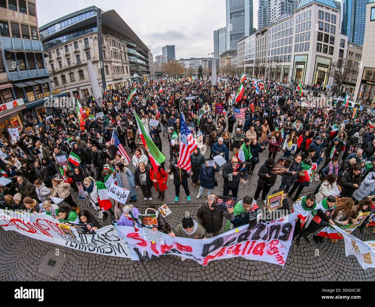 17 January 2026, Hesse, Frankfurt/Main: Participants in a rally against ...