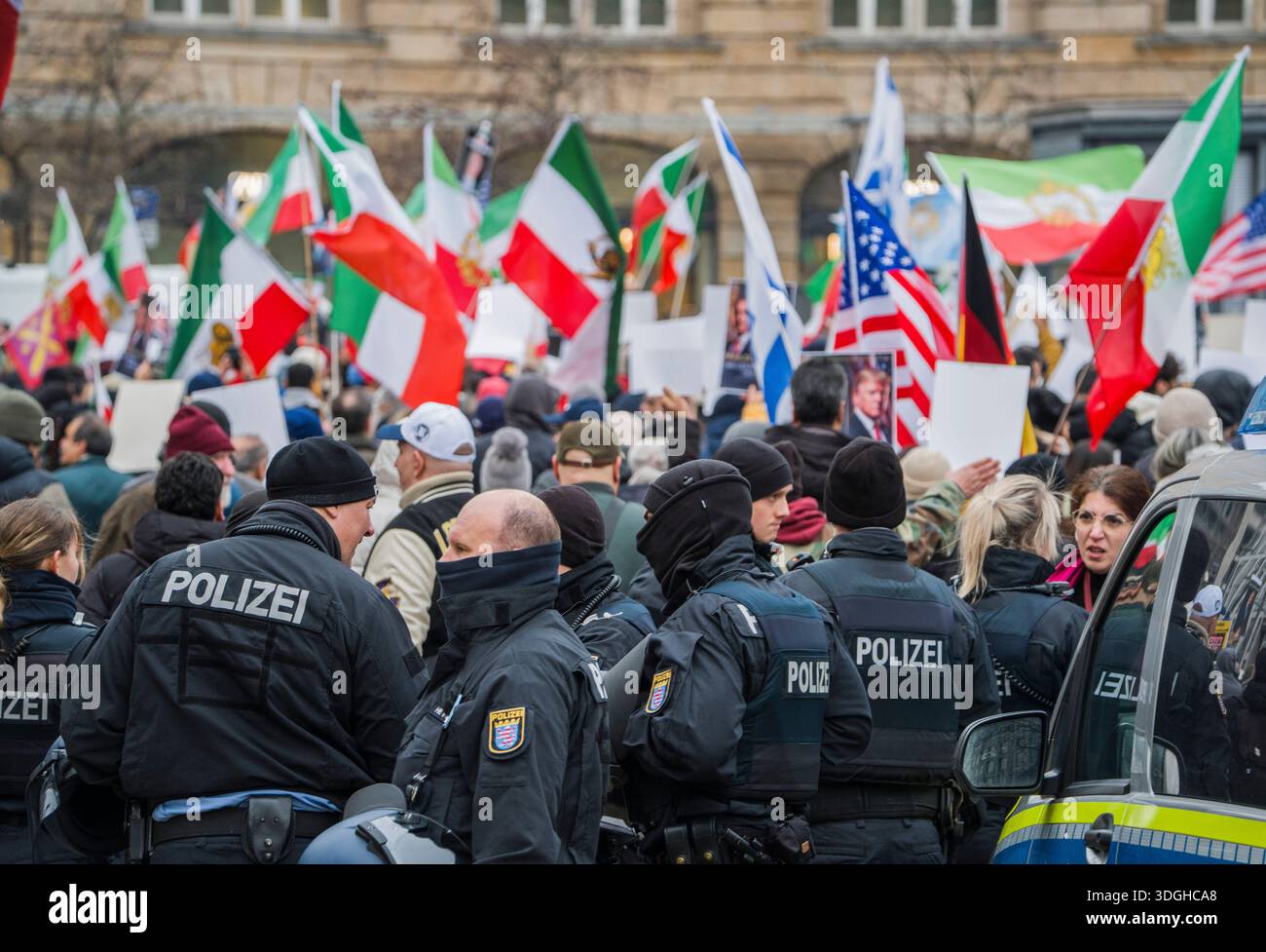 17 January 2026, Hesse, Frankfurt/Main: Police officers accompany a ...