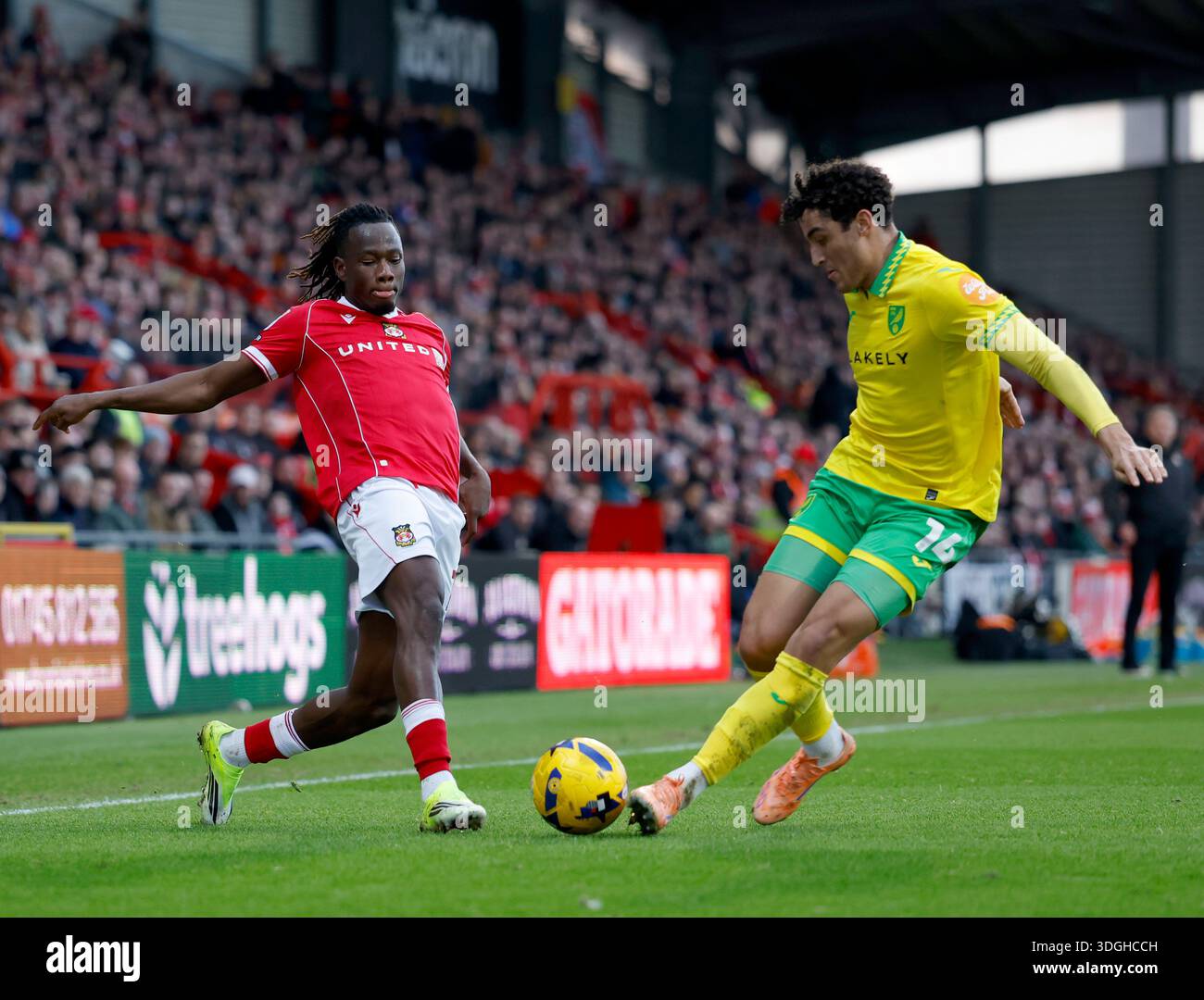 Wrexham's Issa Kabore and Norwich City's Ben Chrisene battle for the ...