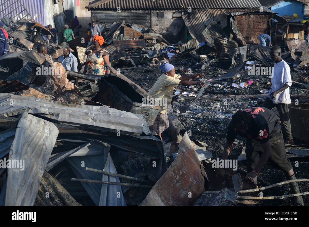 Nairobi, Kenya. 17th Jan, 2026. People clean the debris of houses ...