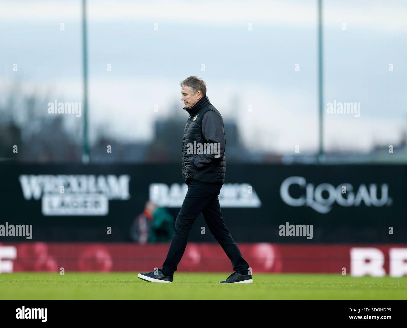 Wrexham manager Phil Parkinson leaves the pitch due to a medical ...
