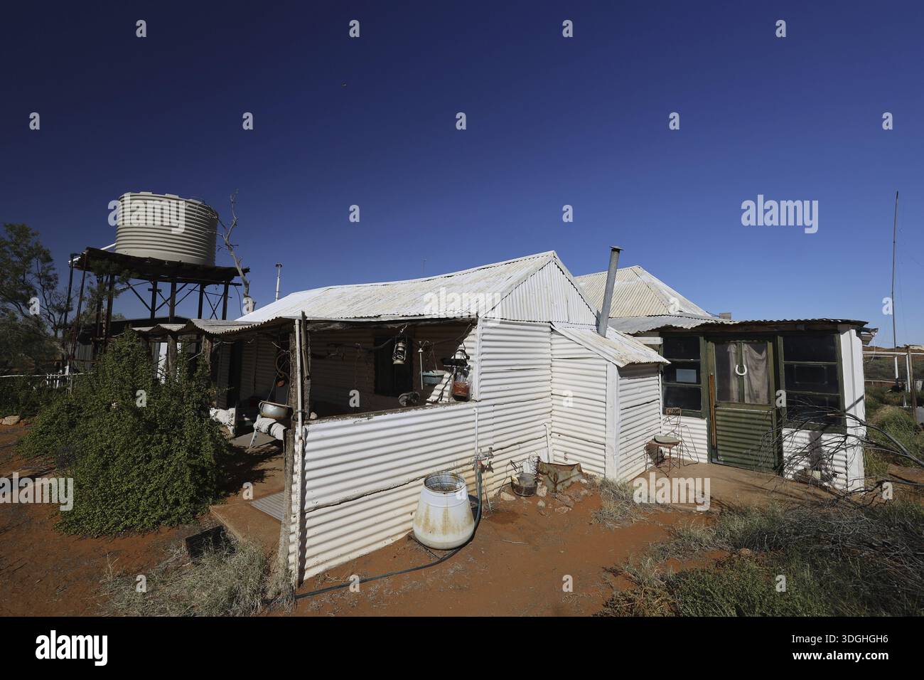Building with water tower under clear sky of Old Andado Station, Old ...