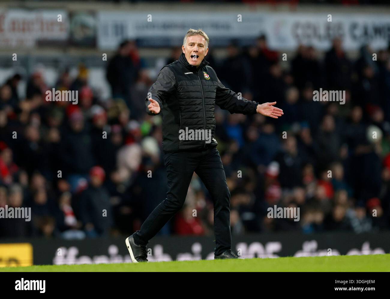 Wrexham manager Phil Parkinson encourages the crowd following a medical ...