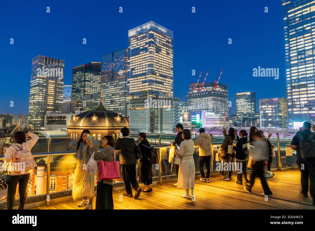 Nighttime, tourists on the KITTE building roof garden with the Gran ...