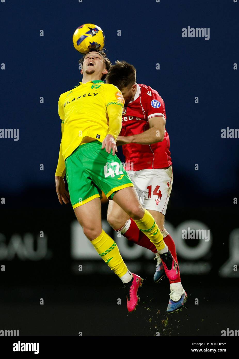 Wrexham's George Thomason and Norwich City's Tony Springett battle for ...