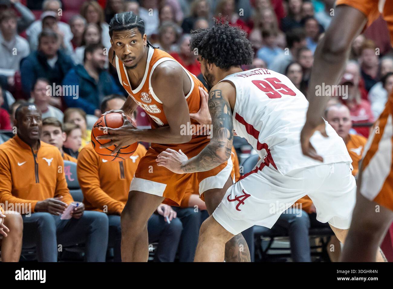 Texas guard Tramon Mark (12) looks inside with Alabama guard Houston ...