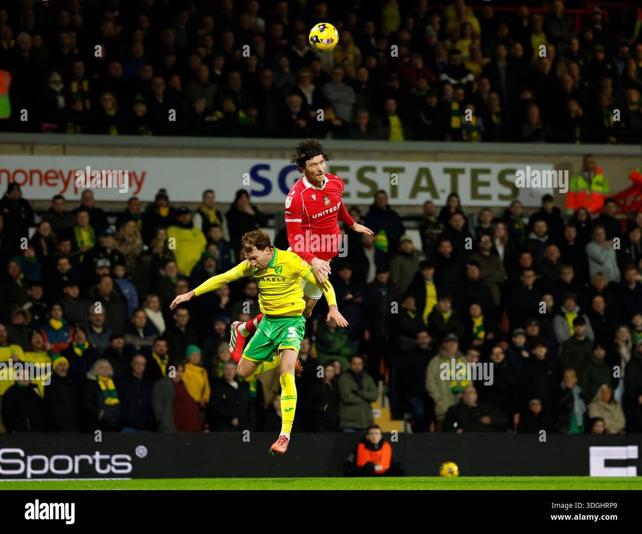 Wrexham's Kieffer Moore heads the ball during the Sky Bet Championship ...