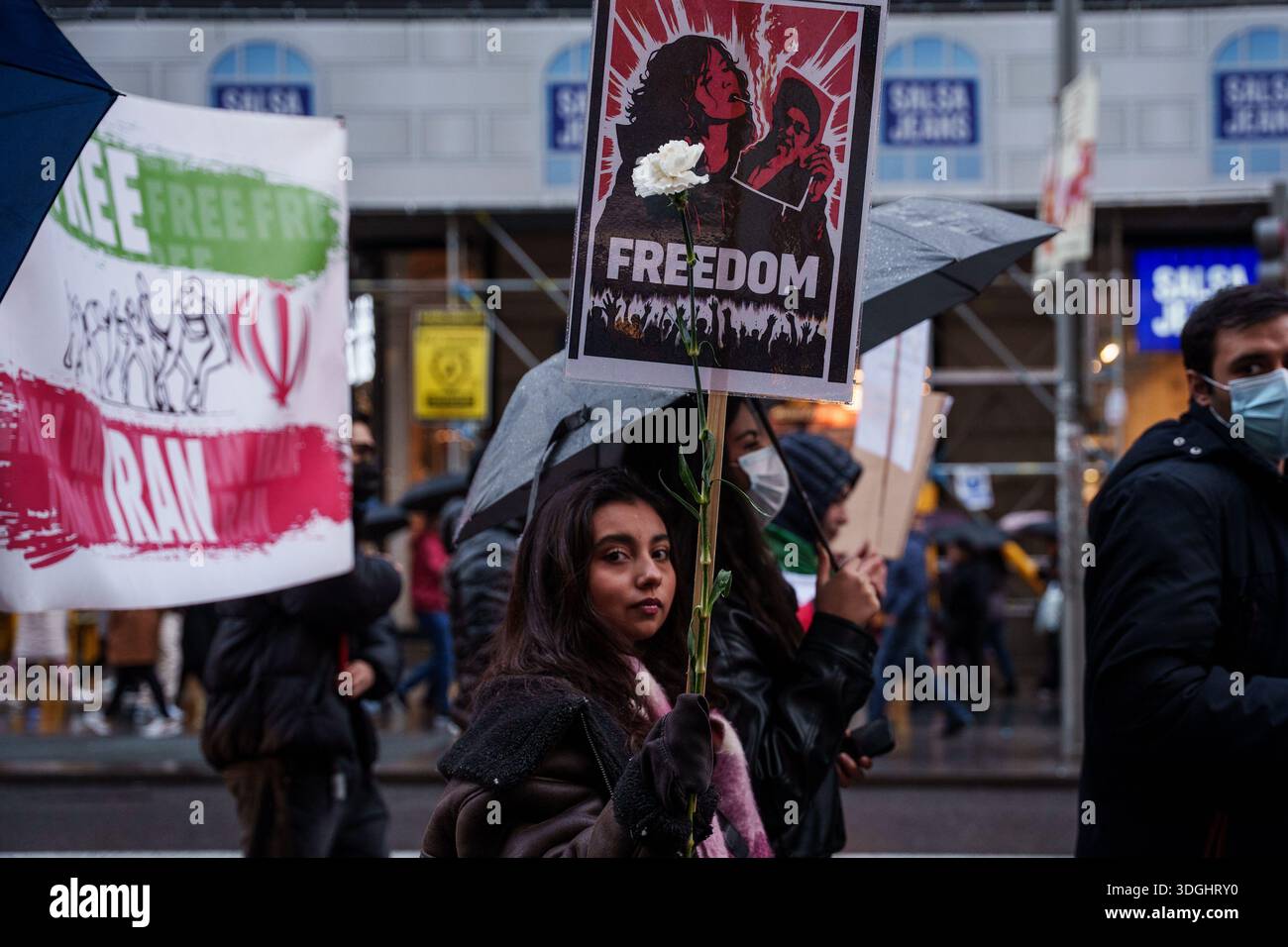 Demonstrator carries a banner with the slogan 'Freedom' during the ...