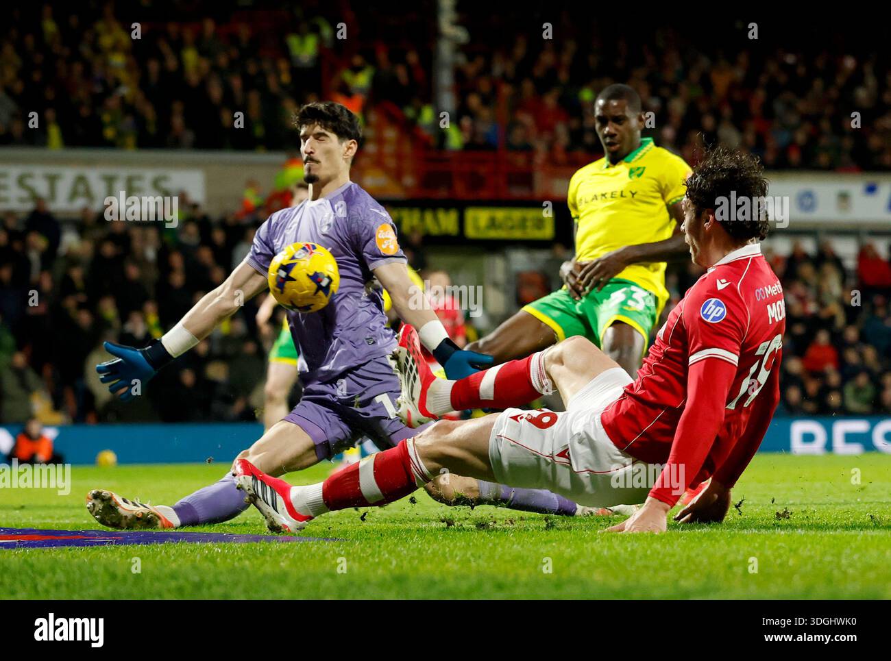 Wrexham's Kieffer Moore saves a shot on goal by Norwich City goalkeeper ...