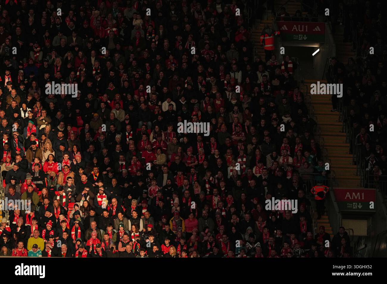 Fans watch the English Premier League soccer match between Liverpool ...