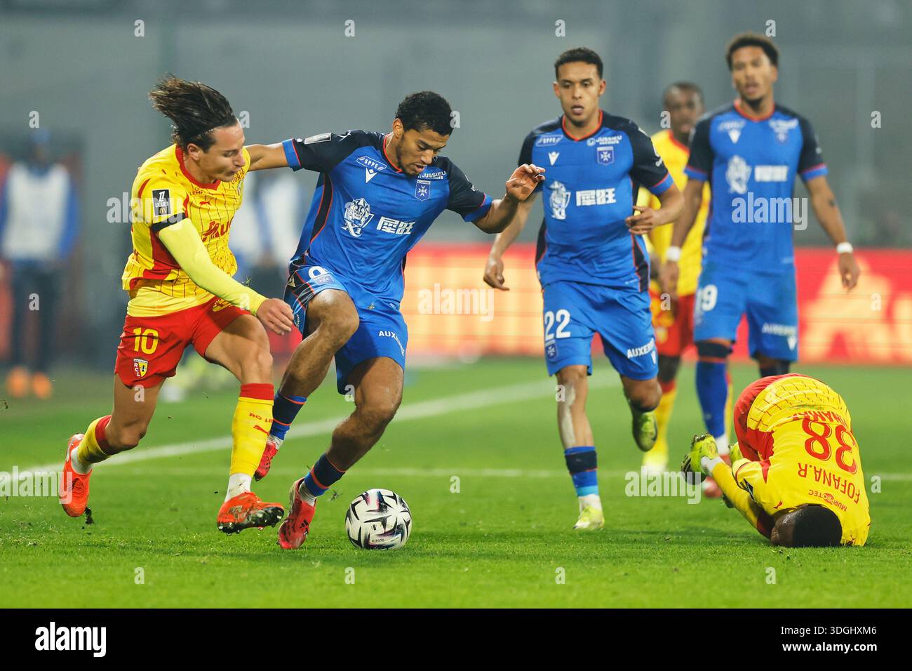 Lens' Florian Thauvin, left, challenges for the ball with Auxerre's ...