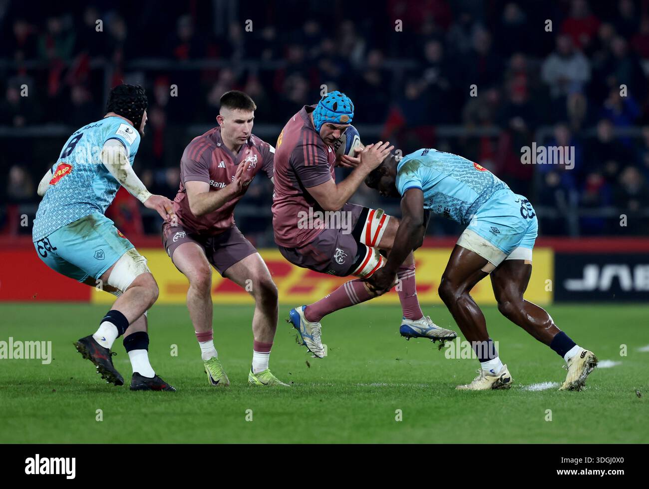 Munster Rugby's Tadhg Beirne (second right) is tackled by Castres ...