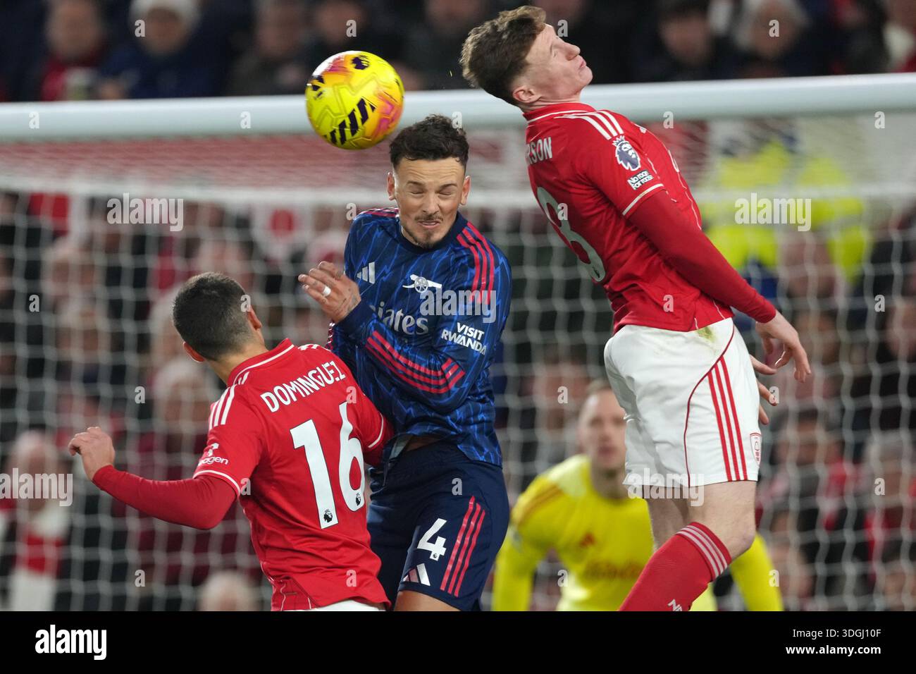 Arsenal's Ben White jumps for the ball with Nottingham Forest's Nicolas ...