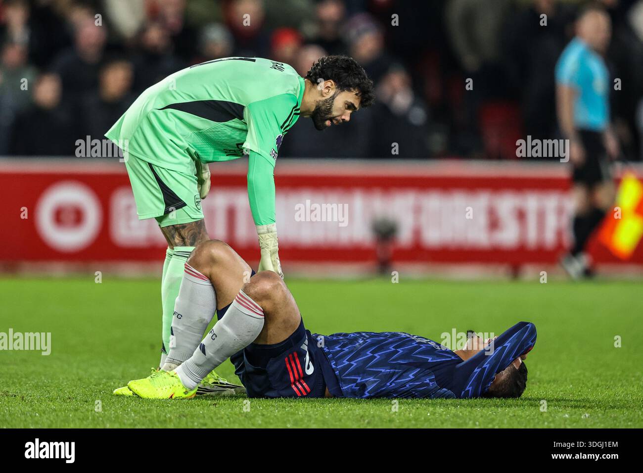 William Saliba of Arsenal takes a knock during the Premier League match ...