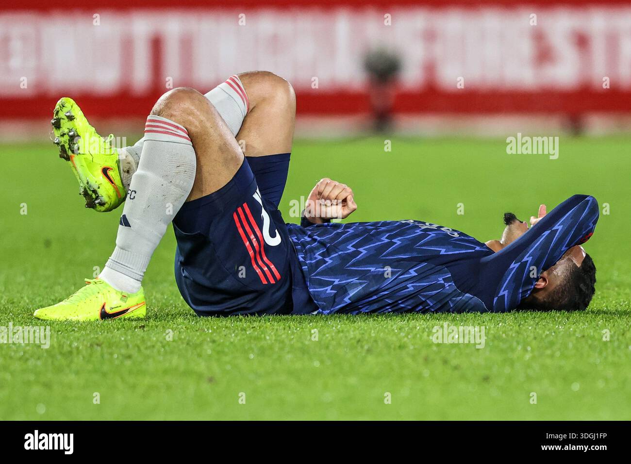 William Saliba of Arsenal takes a knock during the Premier League match ...