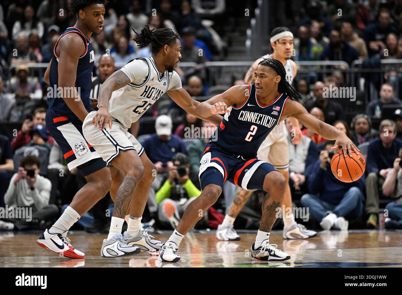 Georgetown Hoyas guard Jeremiah Williams defends against UConn Huskies ...