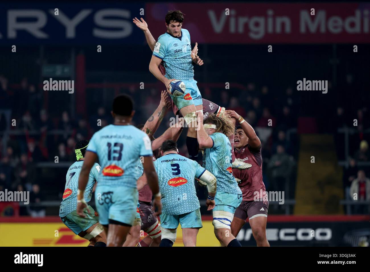Castres' Gauthier Maravat (top) wins a line out during the Investec ...