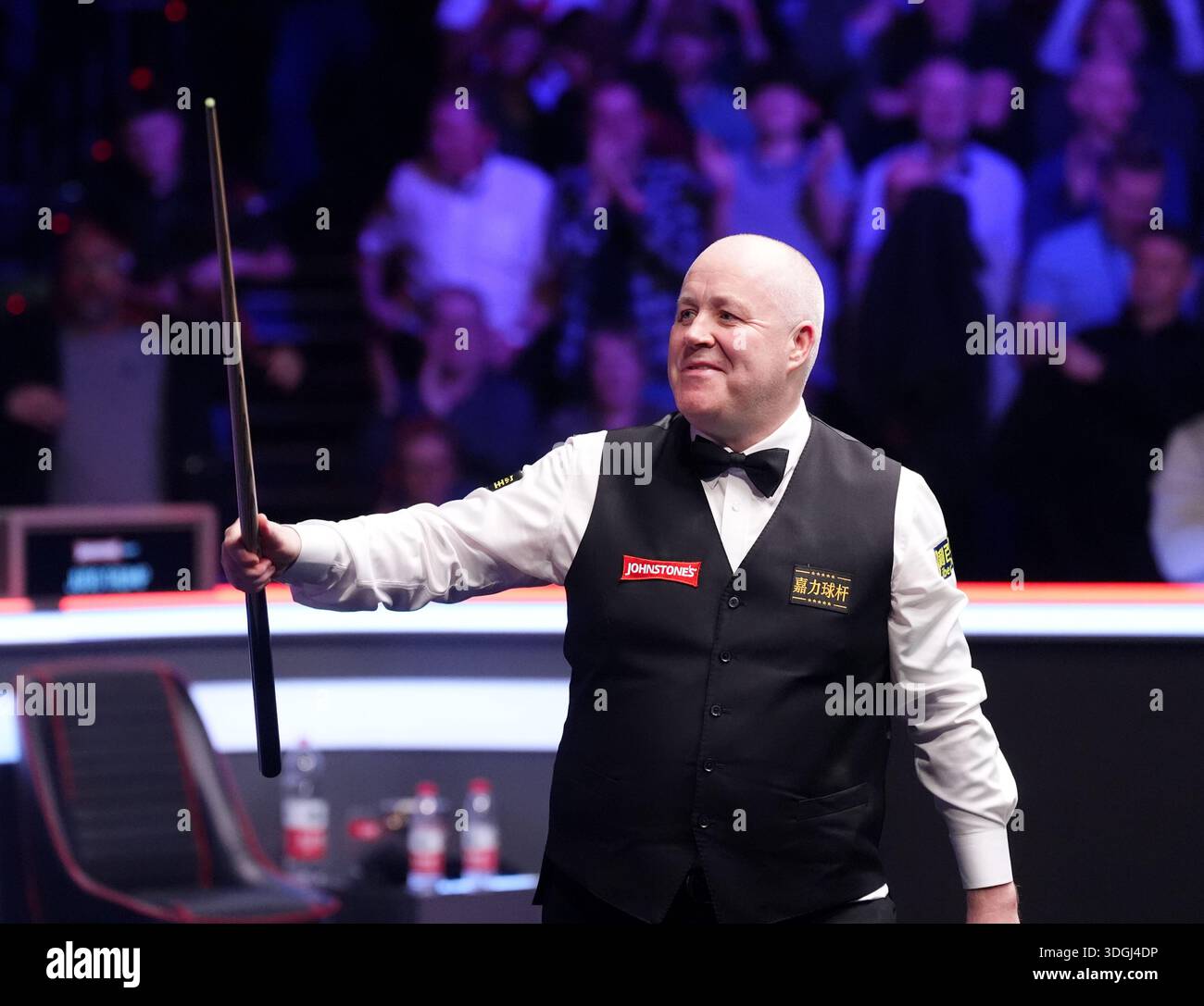 John Higgins celebrates his win against Judd Trump on day seven of the ...